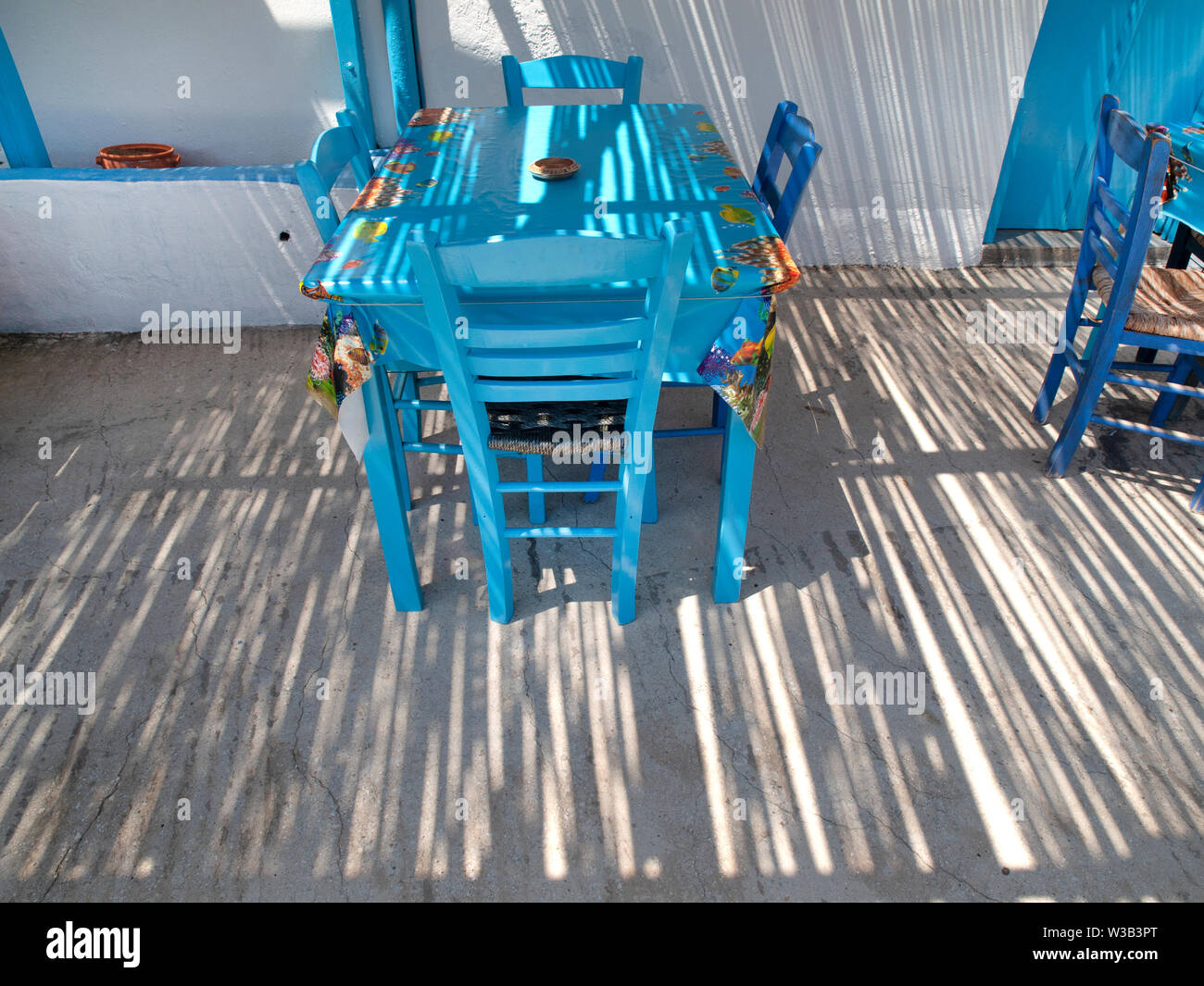 Outside greek restaurant table beach hi-res stock photography and ...