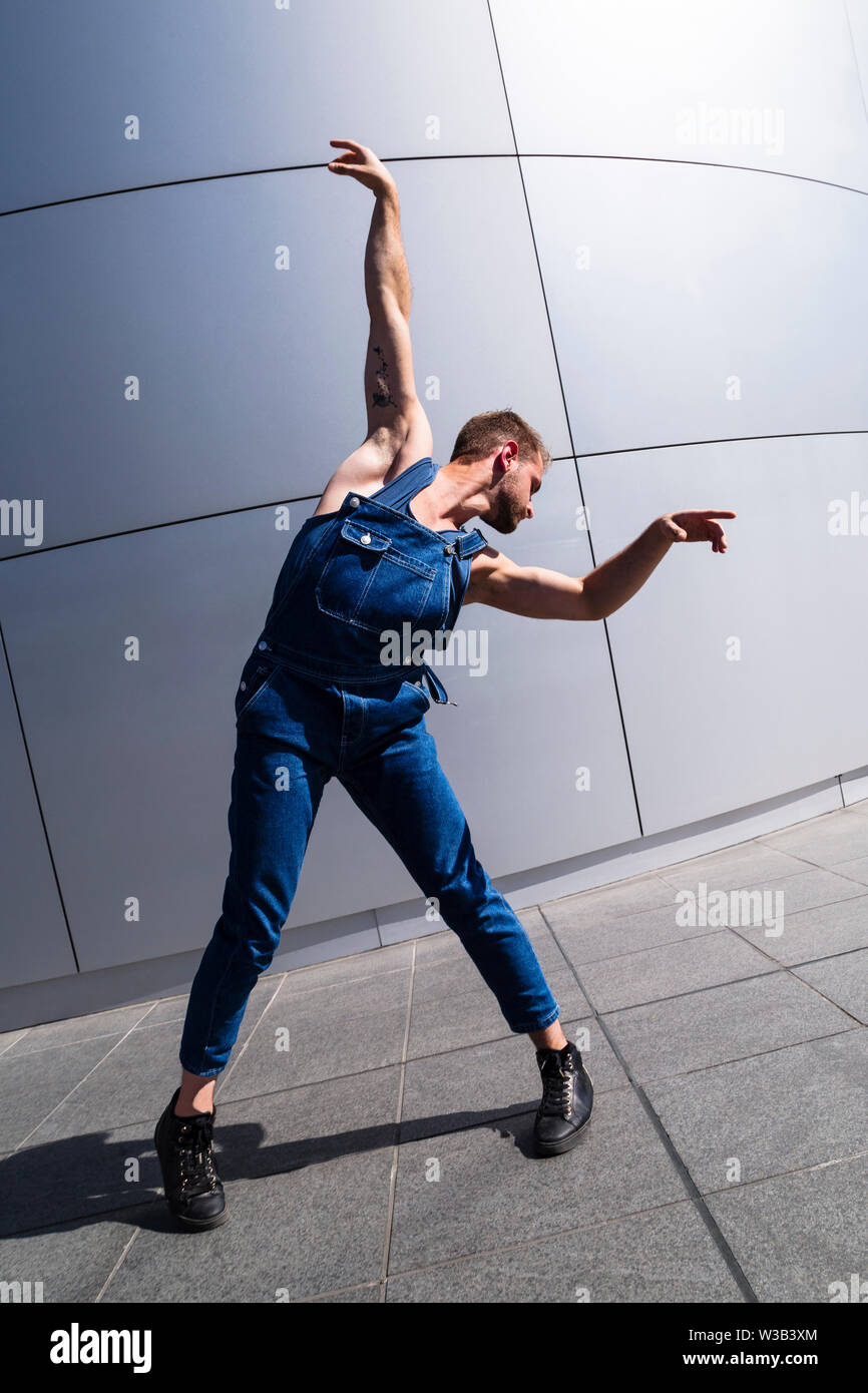 Man doing expressive dancing motion with his arms Stock Photo - Alamy