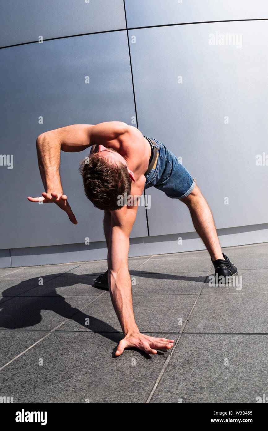 Hip hop dancer twisted in dance in bridge pose Stock Photo - Alamy