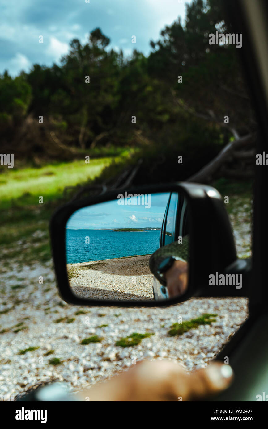 sea reflection in car rear mirror. road trip. summer vacation Stock ...