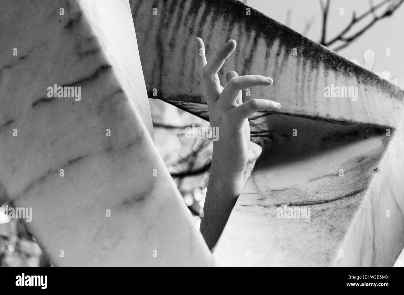 Hand emerging Black and White Stock Photos & Images - Alamy