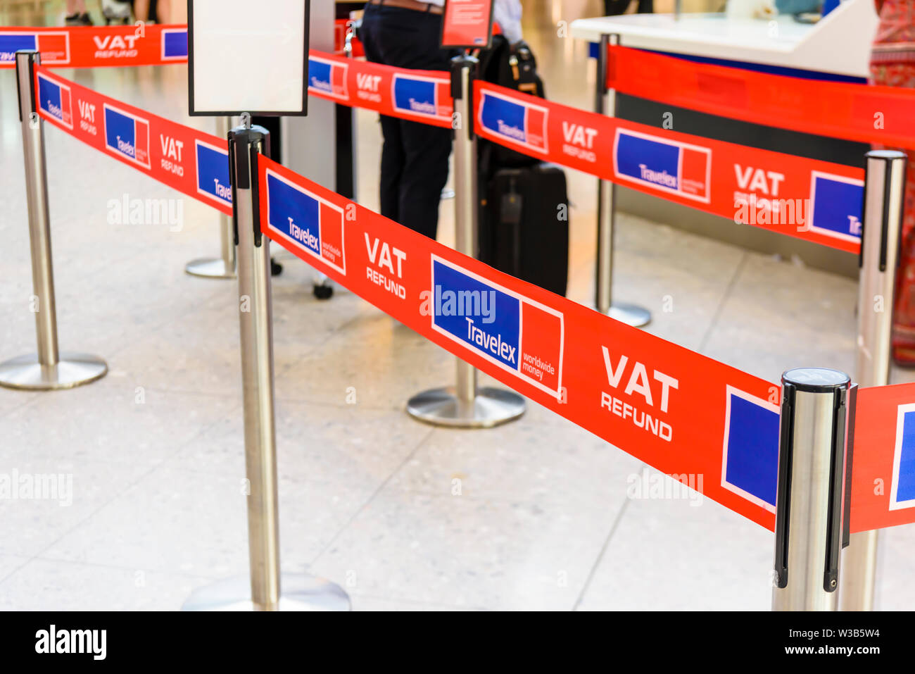 Queue for the VAT Refund desk, operated by Travelex, Terminal 3 ...