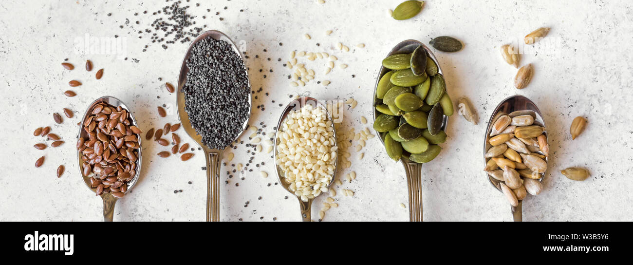Various Seeds on white background. Assortment, set of seeds on spoons ...