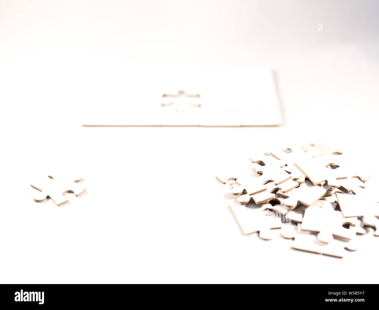 white jigsaw/puzzle whit one gap, symbol of problem solving Stock Photo ...