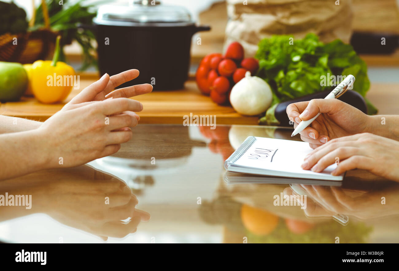 Closeup of human hands discussing something while cooking in kitchen ...