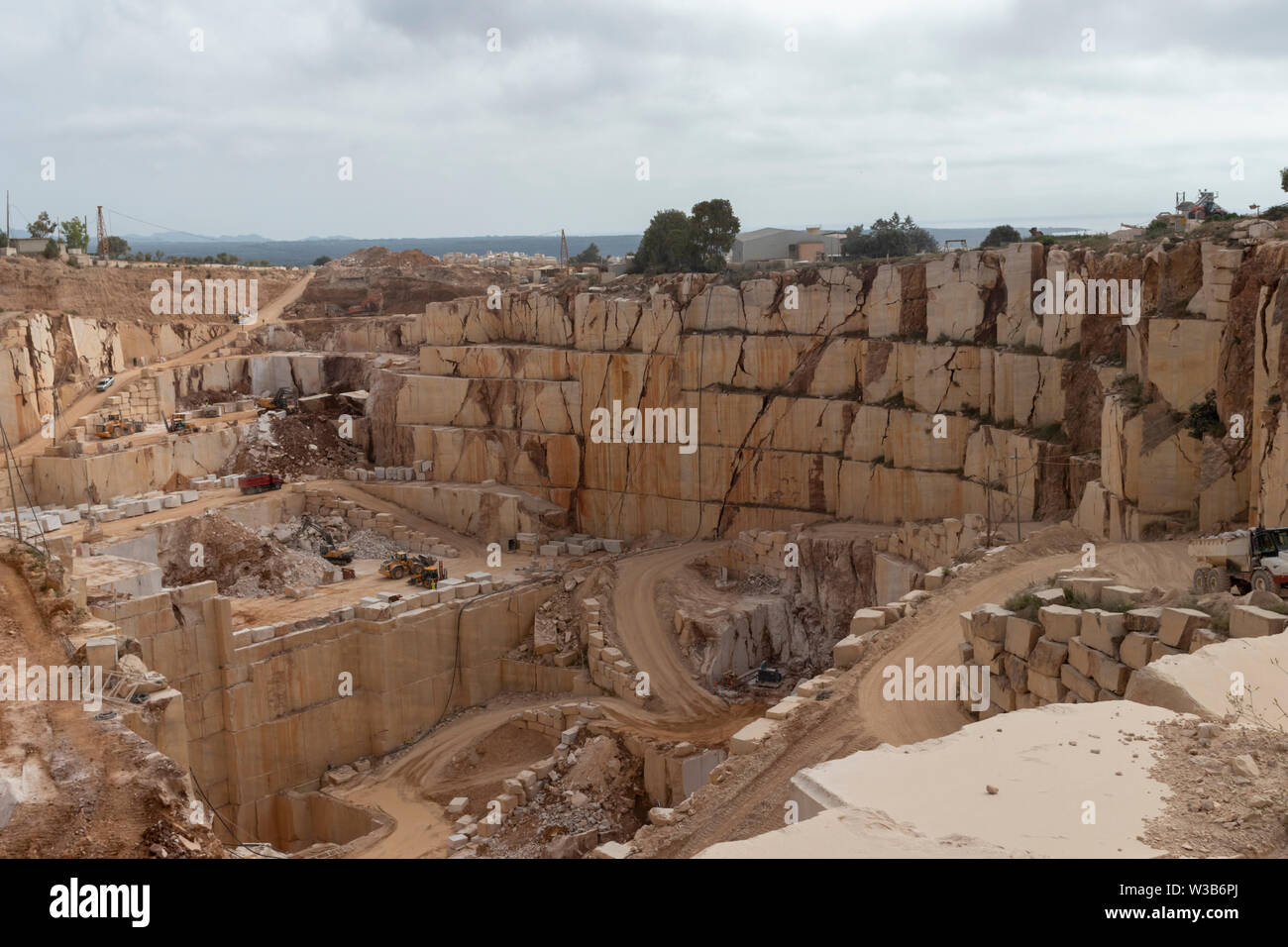 Overhead view of a quarry in Italy, with a number of machines ...