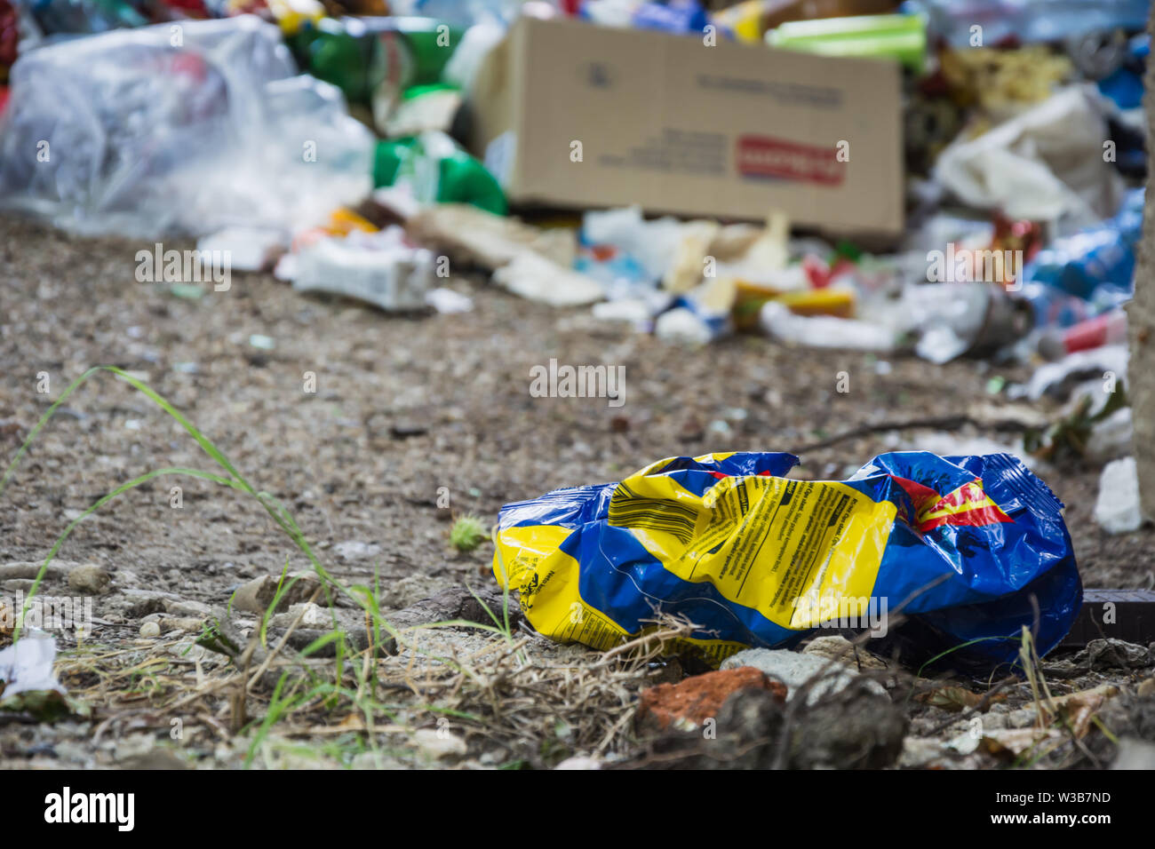 Thrown plastic bag and a bunch of garbage in the background ...