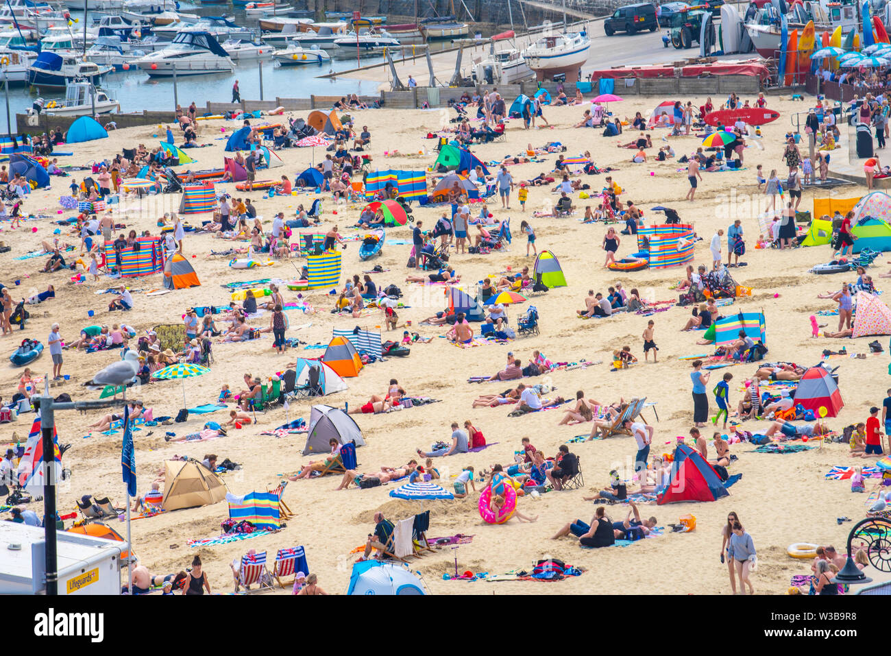Lyme Regis, Dorset, UK. 14th July 2019. UK Weather: Crowds of ...
