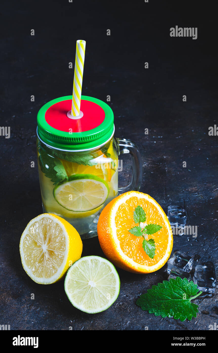 Jar of cool, fresh lemonade made from lemon, lime, orange and mint ...