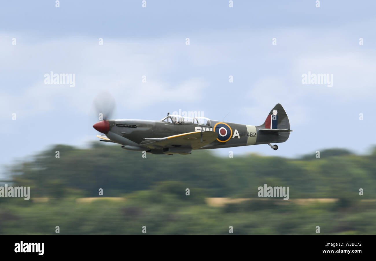 A Spitfire display during the Flying Legends Air Show at IWM Duxford ...