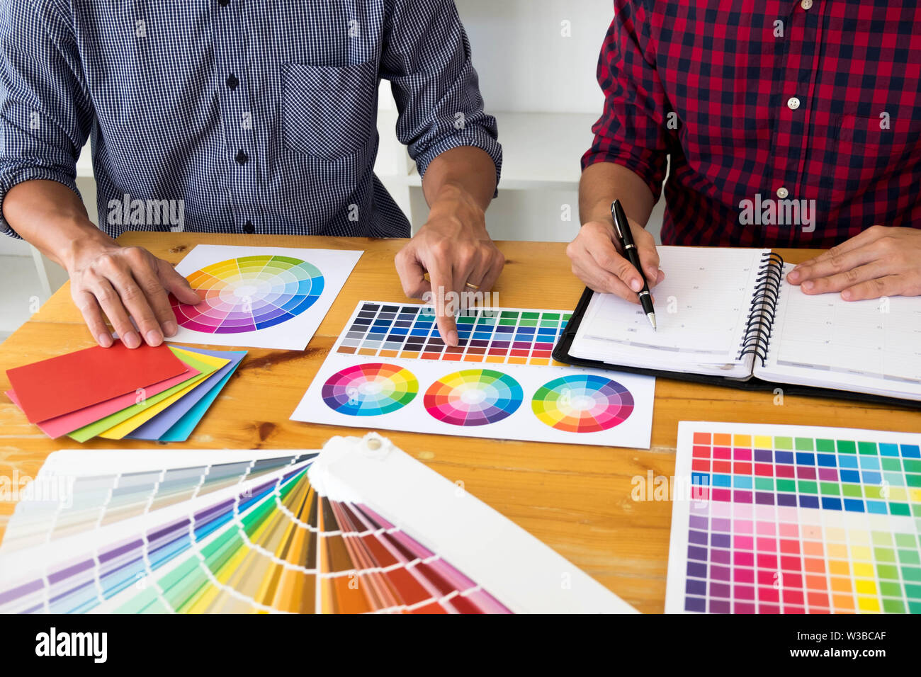 Graphic designers choose colors from the color bands samples for design ...