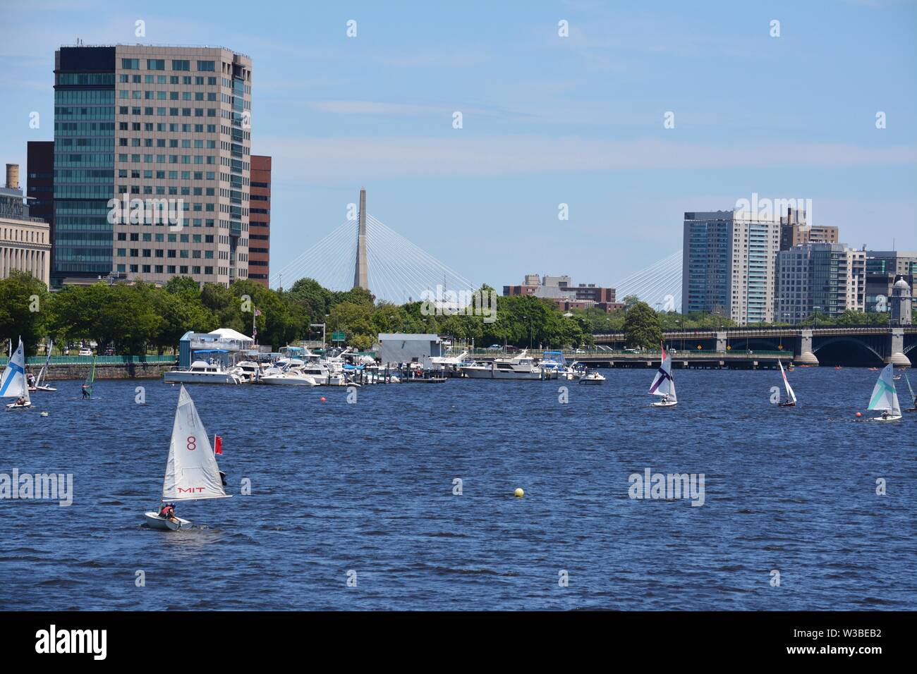 Sailboats sailing in the Charles River Basin with the Boston skyline ...