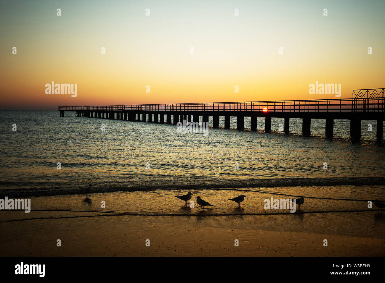 evening seascape with pier Stock Photo - Alamy