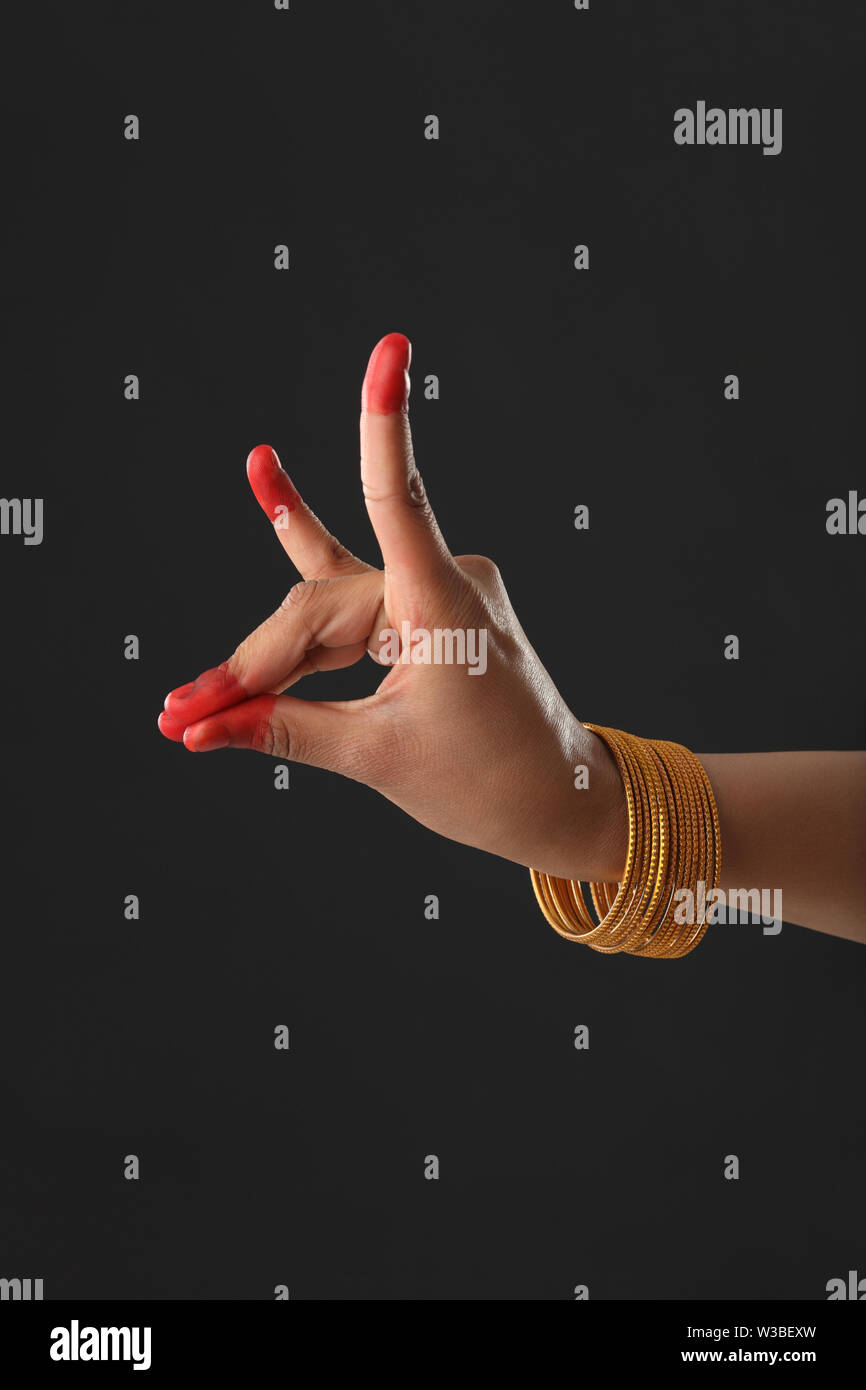Indian woman performing simhamukha hasta hi-res stock photography and ...