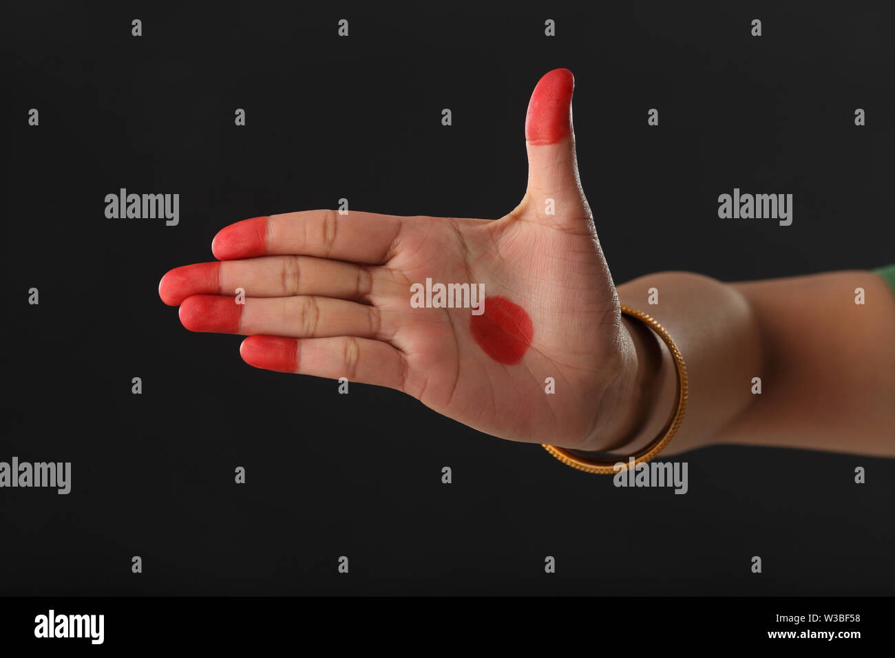 Indian woman performing ardhachandra hasta of Bharatanatyam dance Stock ...