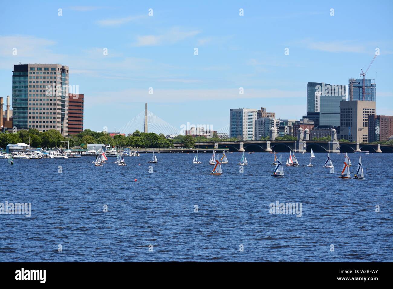 Sailboats sailing in the Charles River Basin with the Boston skyline ...