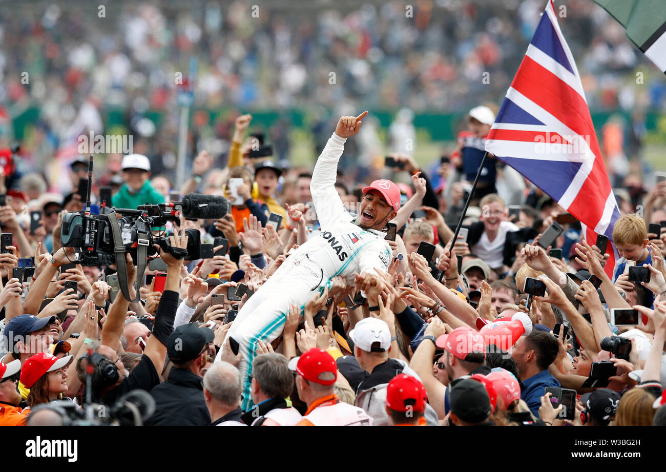 Mercedes driver Lewis Hamilton celebrates winning the British Grand ...
