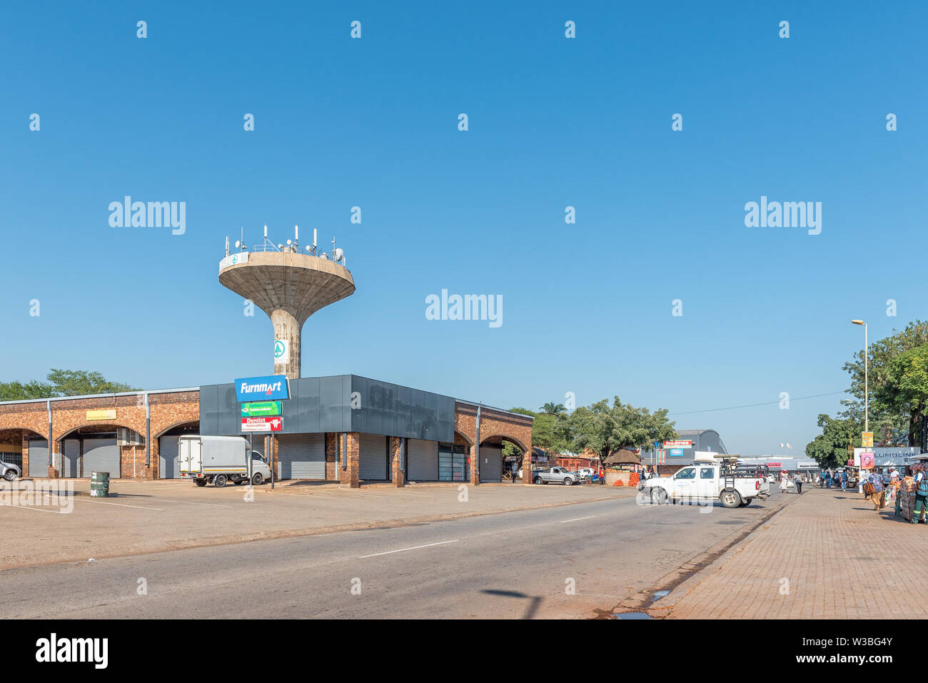 MALELANE, SOUTH AFRICA - MAY 3, 2019: A street scene, with businesses ...