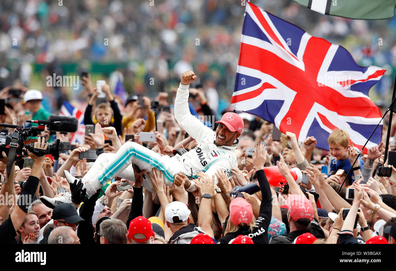 Mercedes driver Lewis Hamilton celebrates winning the British Grand ...