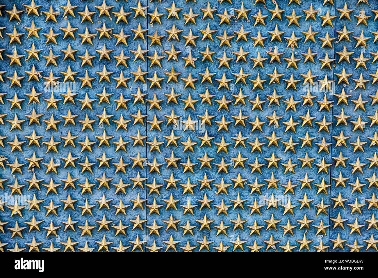 Ranks of bronze stars are arrayed on the Wall of Freedom at the World ...