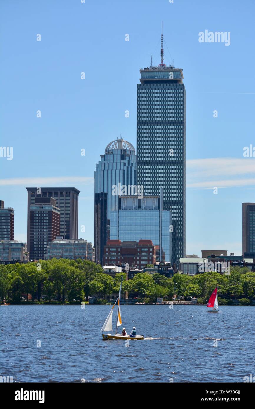 Sailboats sailing in the Charles River Basin with the Boston skyline ...