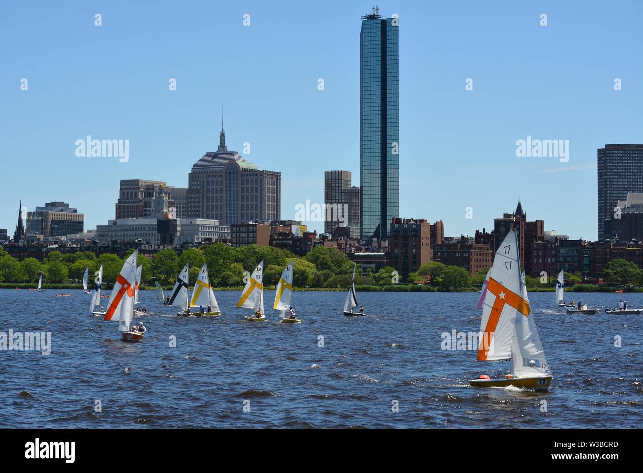 Sailboats sailing in the Charles River Basin with the Boston skyline ...