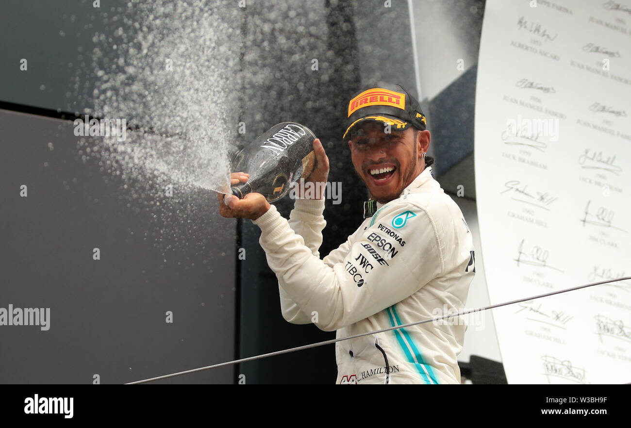 Mercedes driver Lewis Hamilton celebrates his victory in parc ferme ...