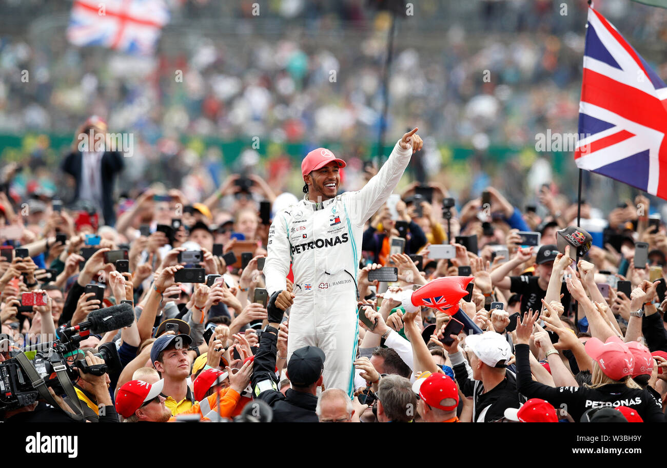 Mercedes driver Lewis Hamilton celebrates winning the British Grand ...