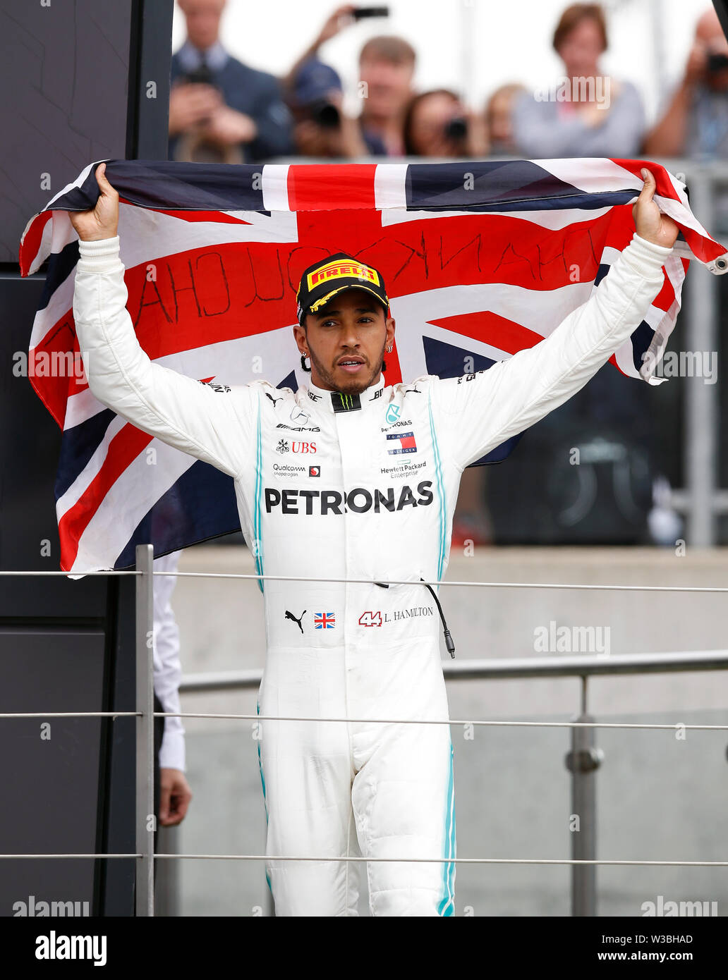 Mercedes driver Lewis Hamilton celebrates winning the British Grand ...