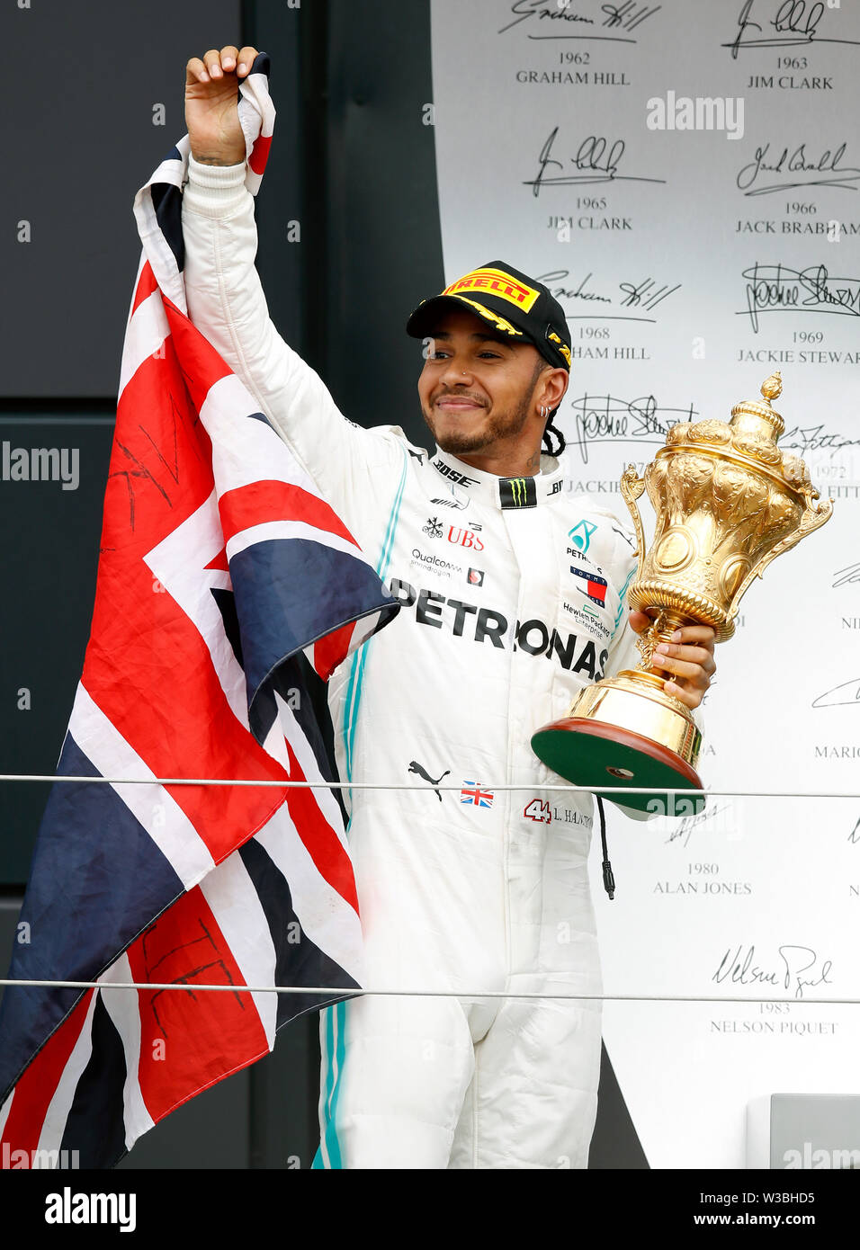 Mercedes driver Lewis Hamilton celebrates winning the British Grand ...