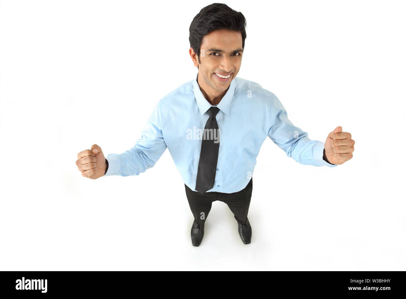 Portrait of a of a businessman punching the air Stock Photo - Alamy