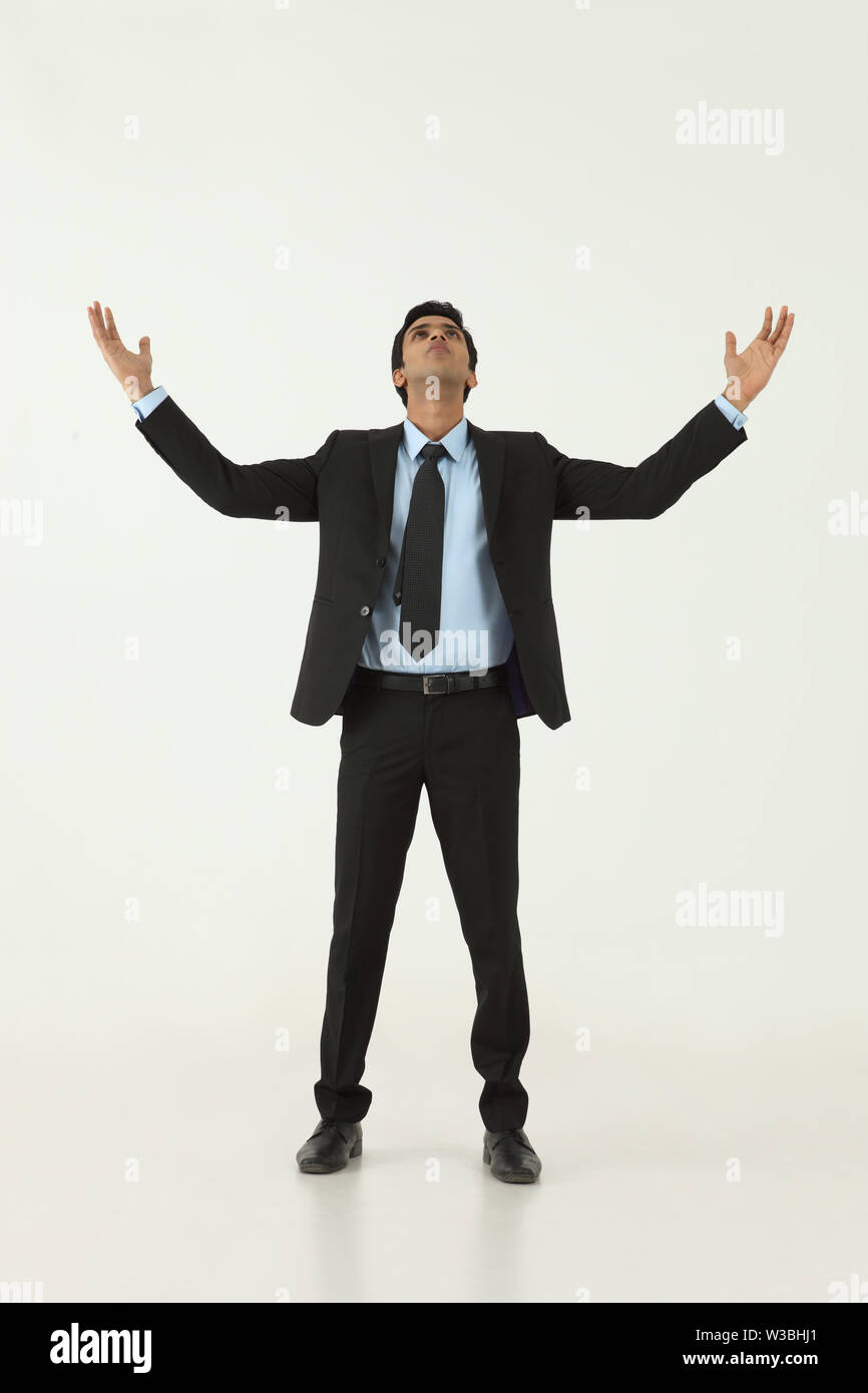 Businessman standing with his arm outstretched Stock Photo - Alamy