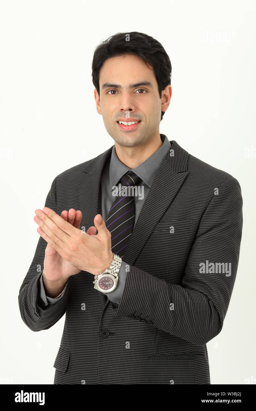 Portrait of a businessman clapping Stock Photo - Alamy