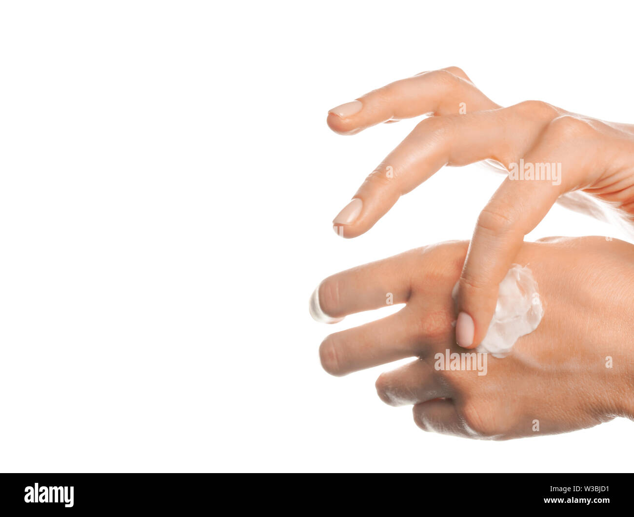 Fingers apply cream to skin. Close up Stock Photo - Alamy