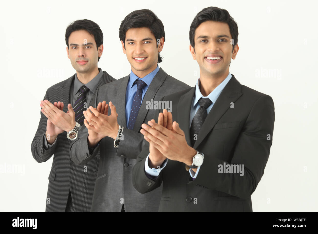 Portrait of business executives clapping Stock Photo - Alamy
