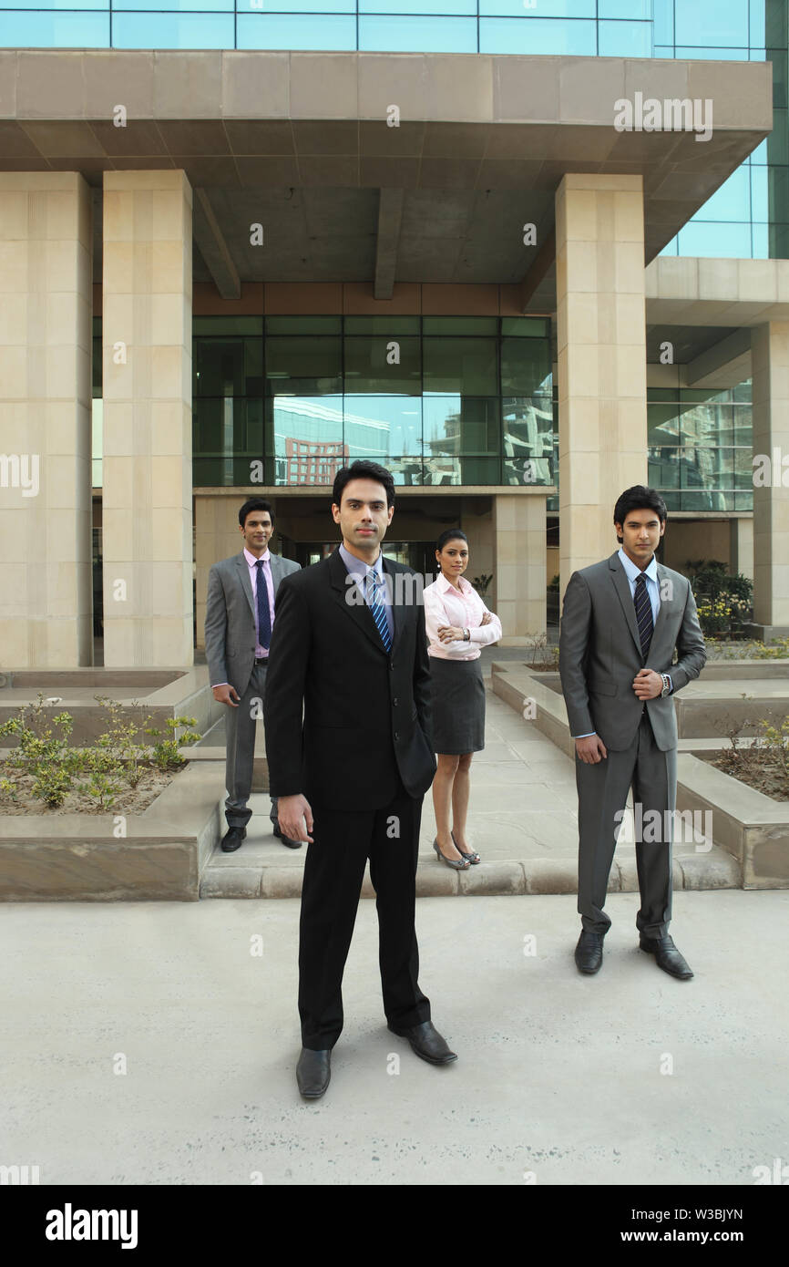 Authority leadership standing building exterior hi-res stock ...