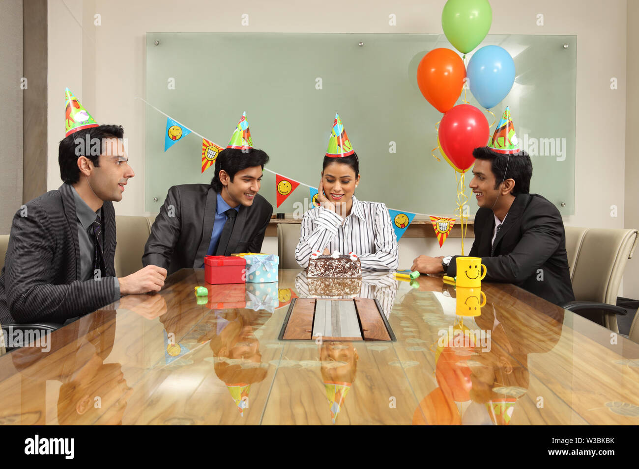 Business people celebrating a colleague birthday in Office Stock Photo ...