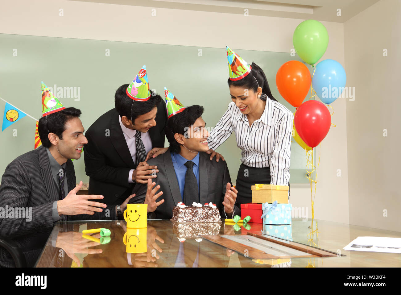Business people celebrating a colleague birthday in Office Stock Photo ...