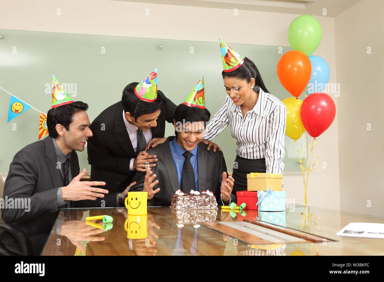 Business people celebrating a colleague birthday in Office Stock Photo ...