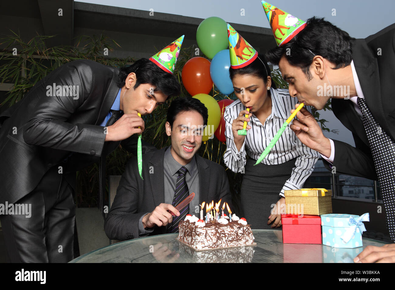 Business people celebrating a colleague birthday in Office Stock Photo ...
