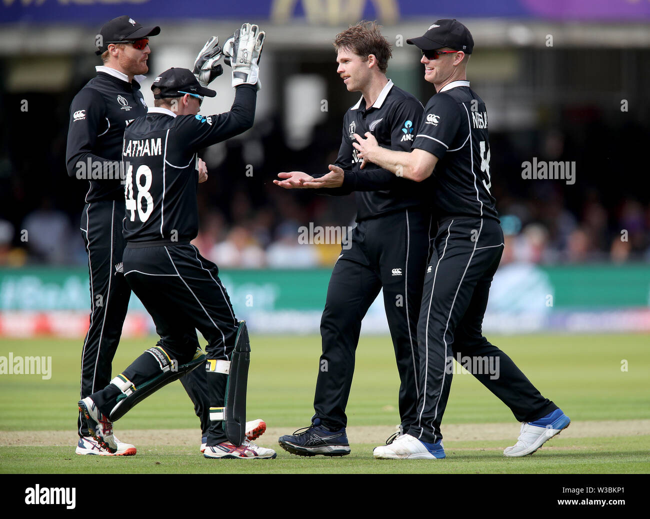 New Zealand's Lockie Ferguson (second right) celebrates bowling out ...