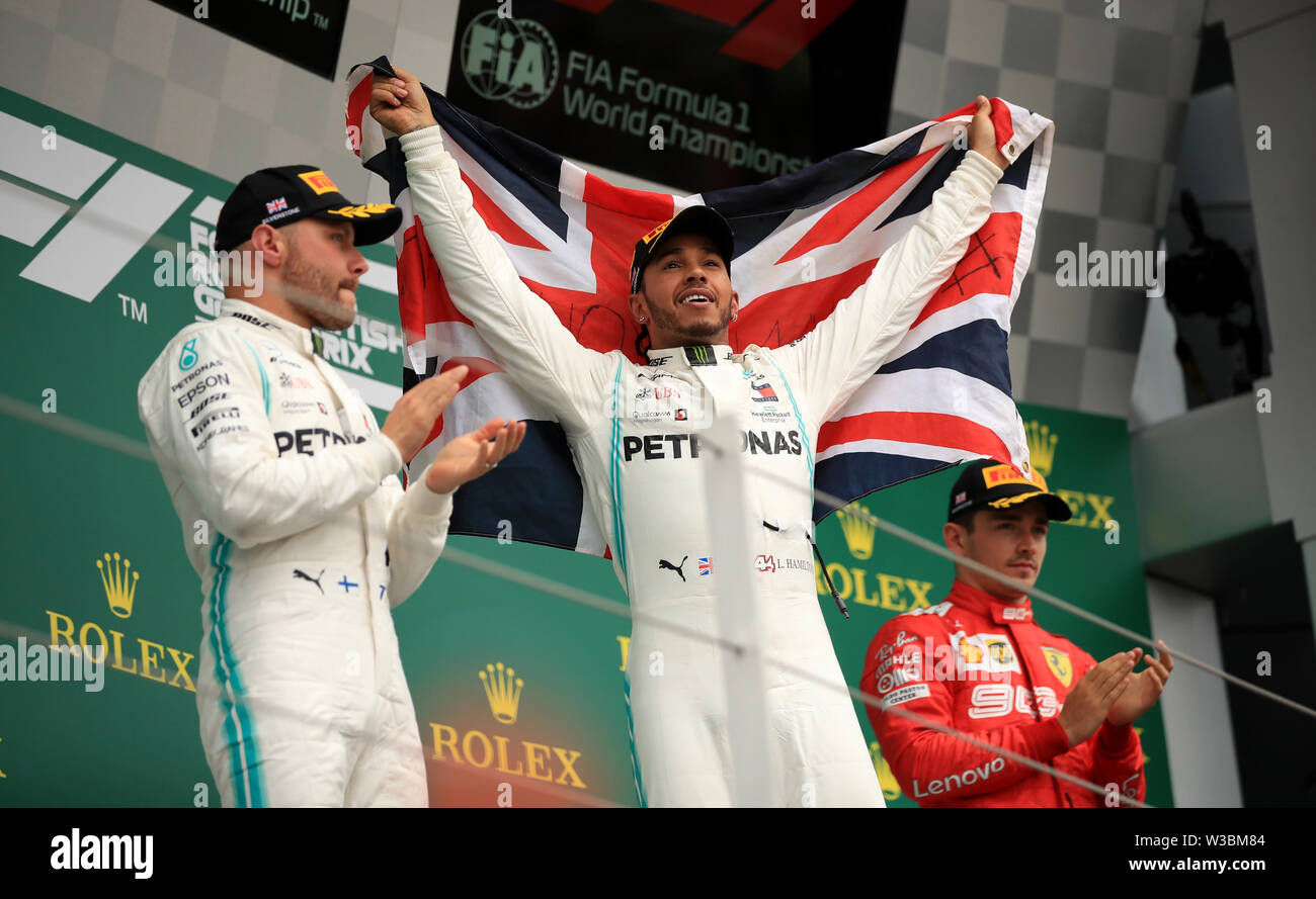 Mercedes driver lewis hamilton celebrates victory on podium hi-res ...