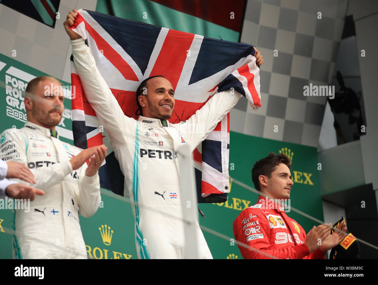 Mercedes driver lewis hamilton celebrates victory on podium hi-res ...