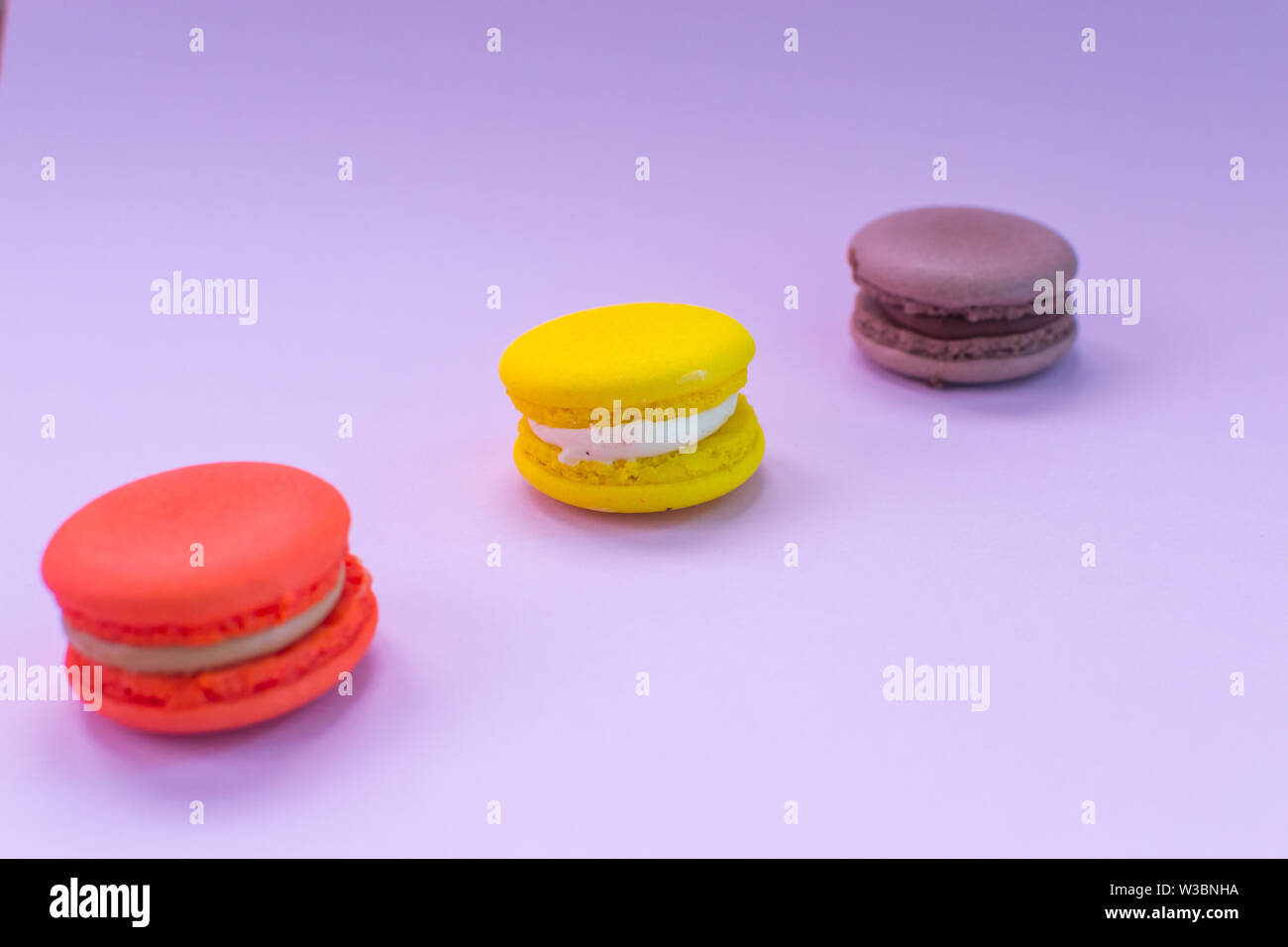 Close-up shot of colored macaroons in different position Stock Photo ...