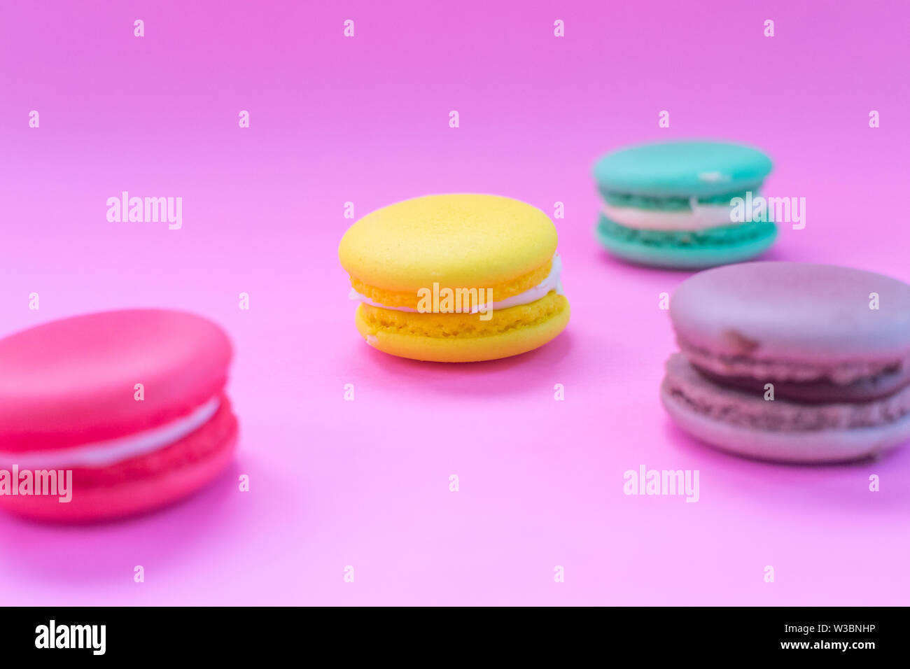 Close-up shot of colored macaroons in different position Stock Photo ...