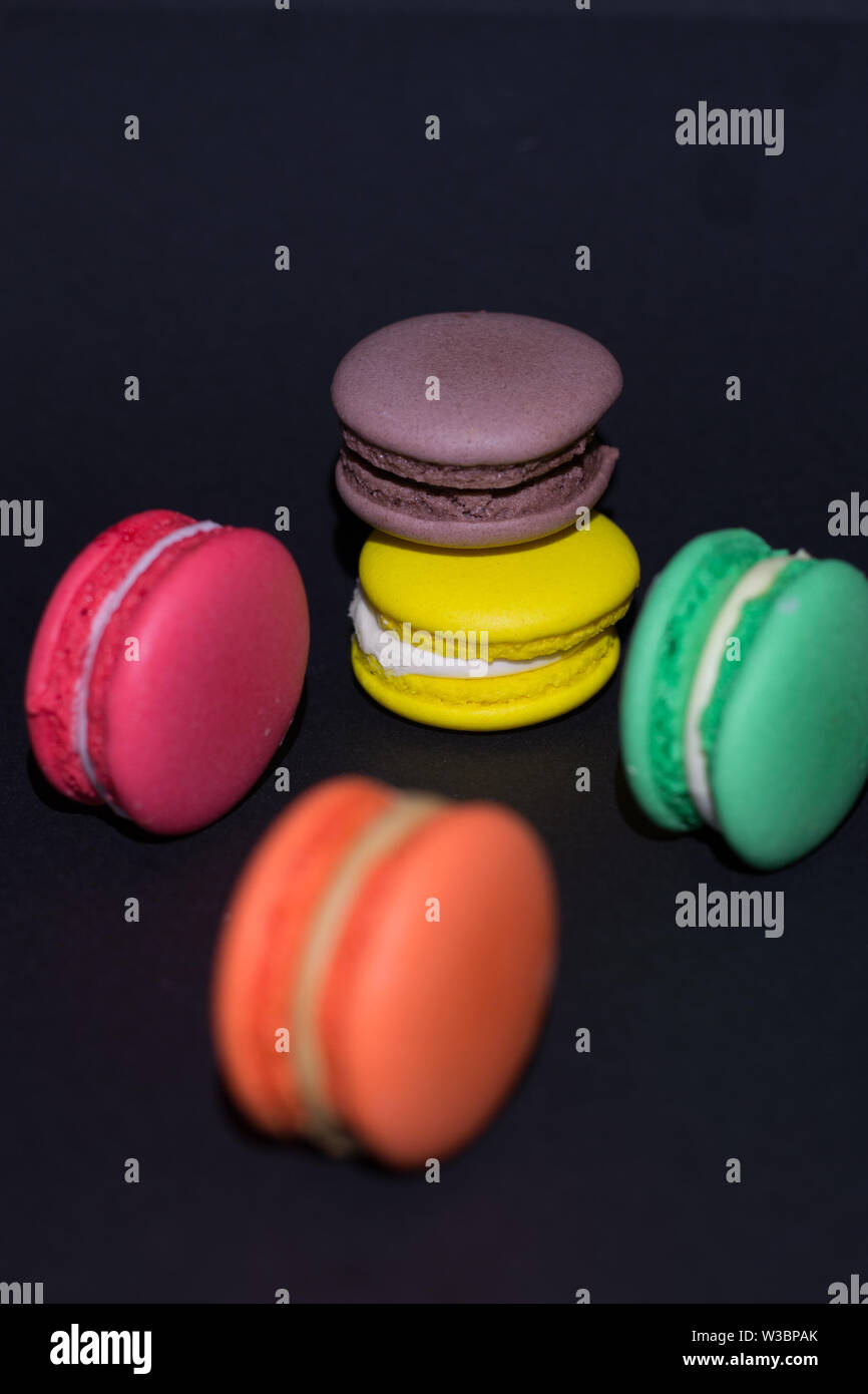 Close-up shot of colored macaroons in different position Stock Photo ...