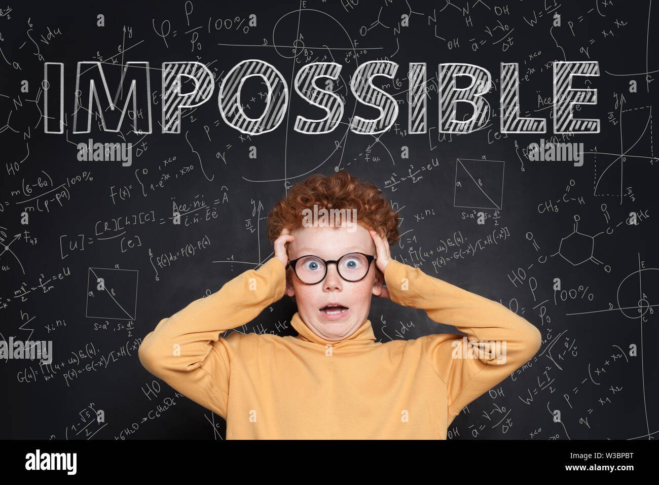 Scared kid wearing glasses with text Impossible on chalkboard ...