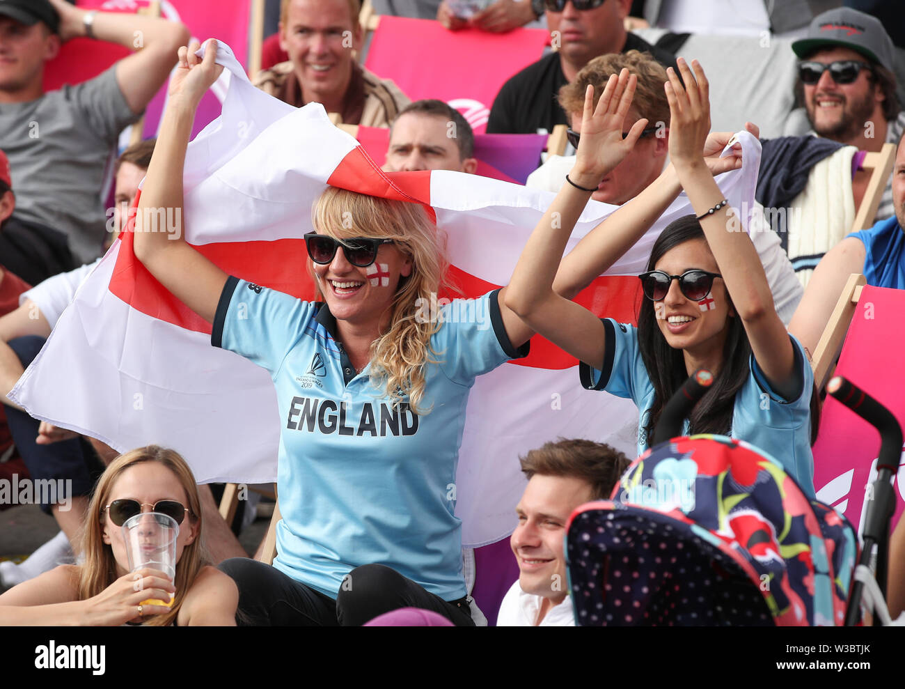 England fans react as they watch a big screen in the Fanzone at ...