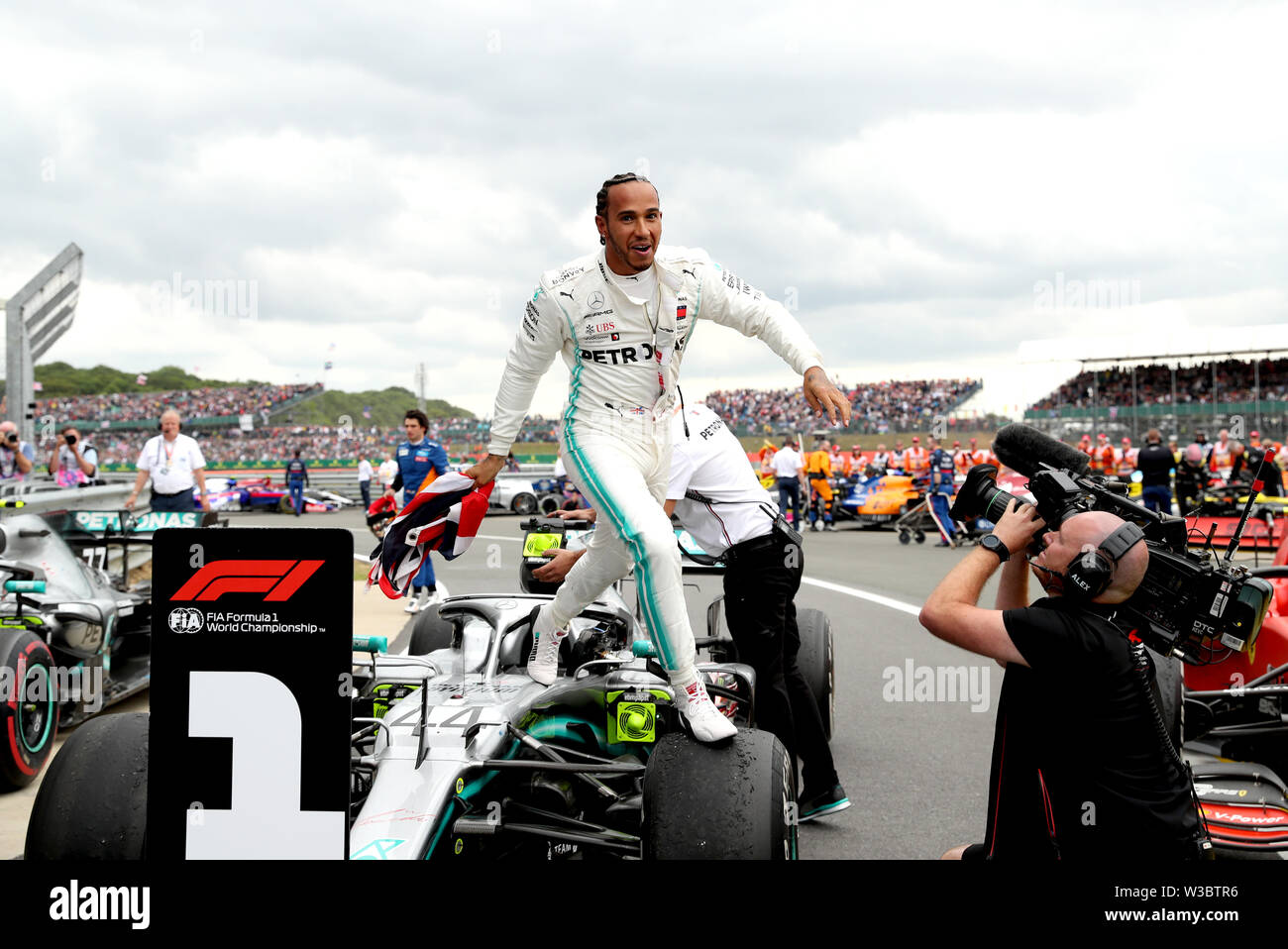 Mercedes' Lewis Hamilton celebrates winning the British Grand Prix at ...