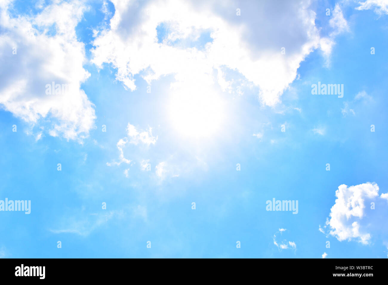 Bright sunny sky with clouds Stock Photo - Alamy